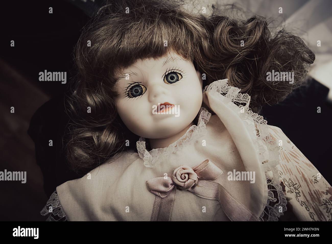 Macabre looking horror toy doll in a vintage dark and moody tone Stock ...