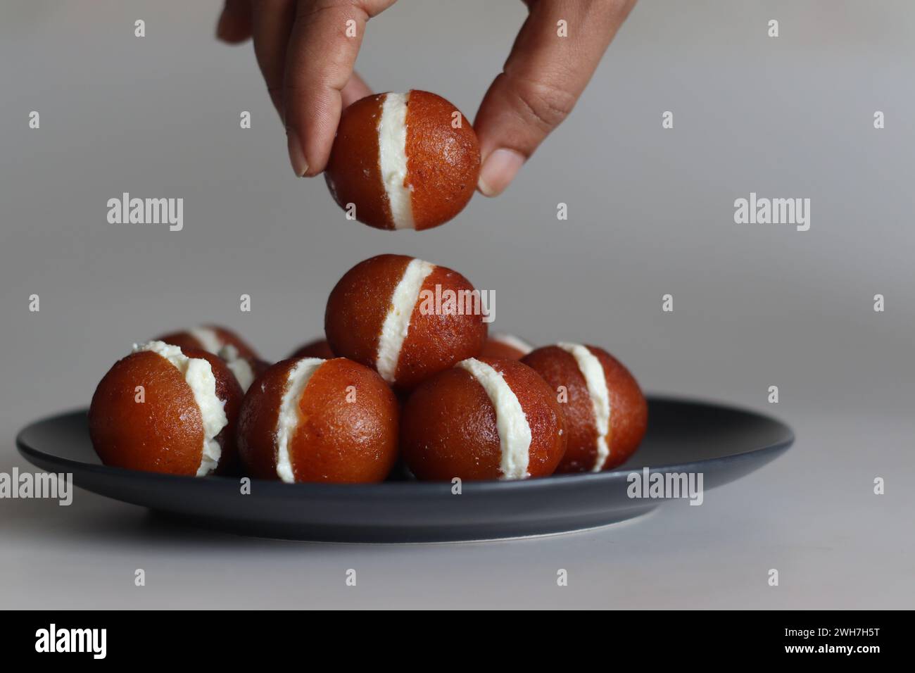 Malai Gulab Jamun. Gulab Jamun sandwich with milk cream filling. Fusion ...