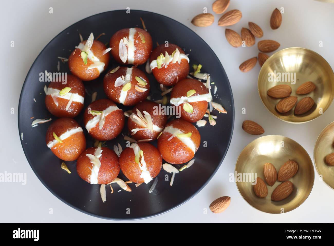 Malai Gulab Jamun. Gulab Jamun sandwich with milk cream filling. Fusion ...