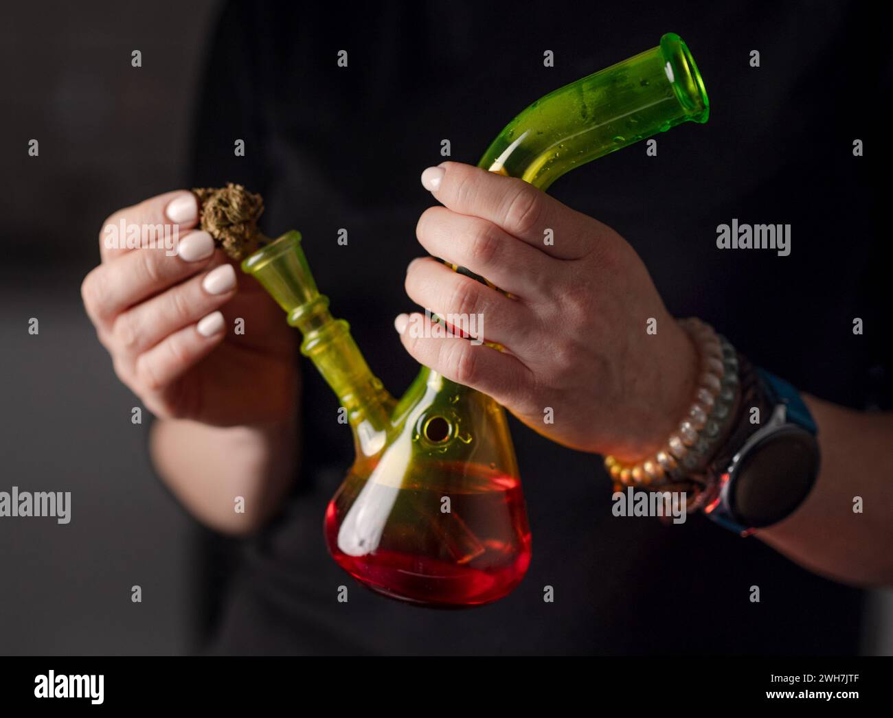 Woman Fills Bong With Cannabis Leaves, Detail Of Female Hand Preparing ...