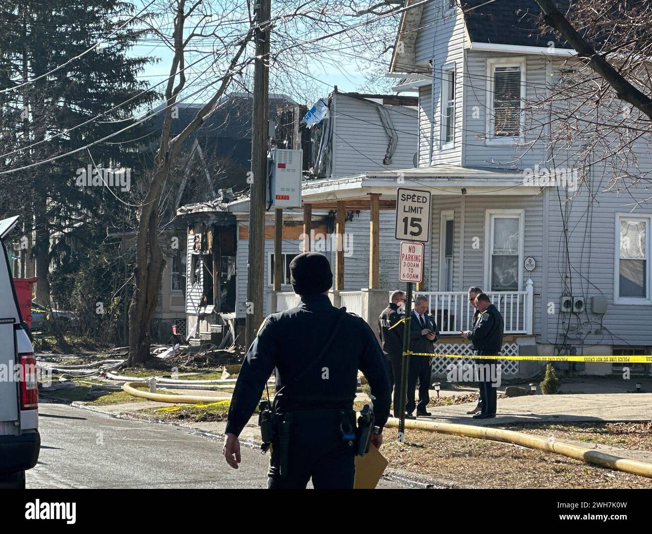 Emergency personnel work at the scene where two police officers were ...