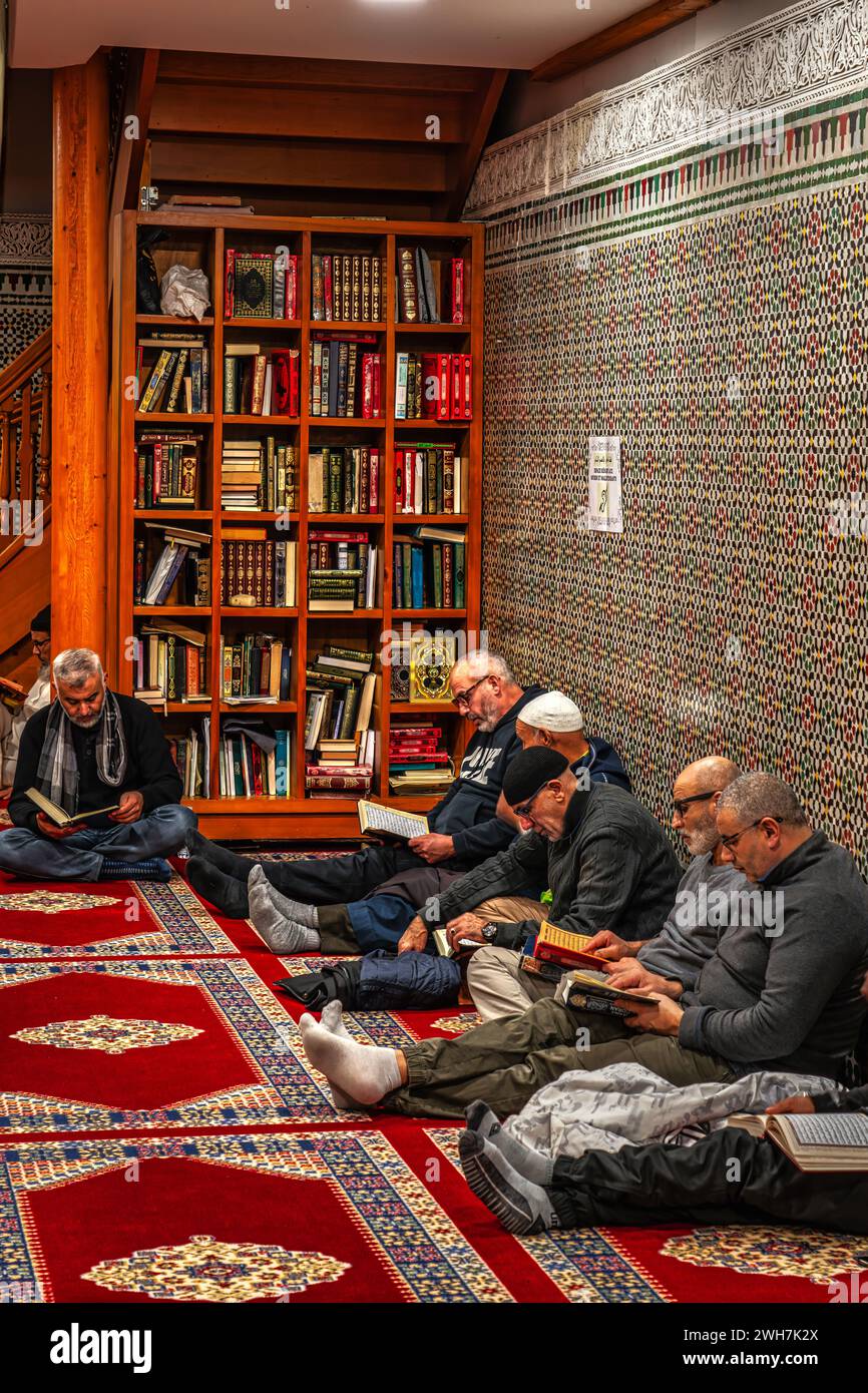 Inside the Grand Mohammed VI Mosque people recite prayers and read the ...