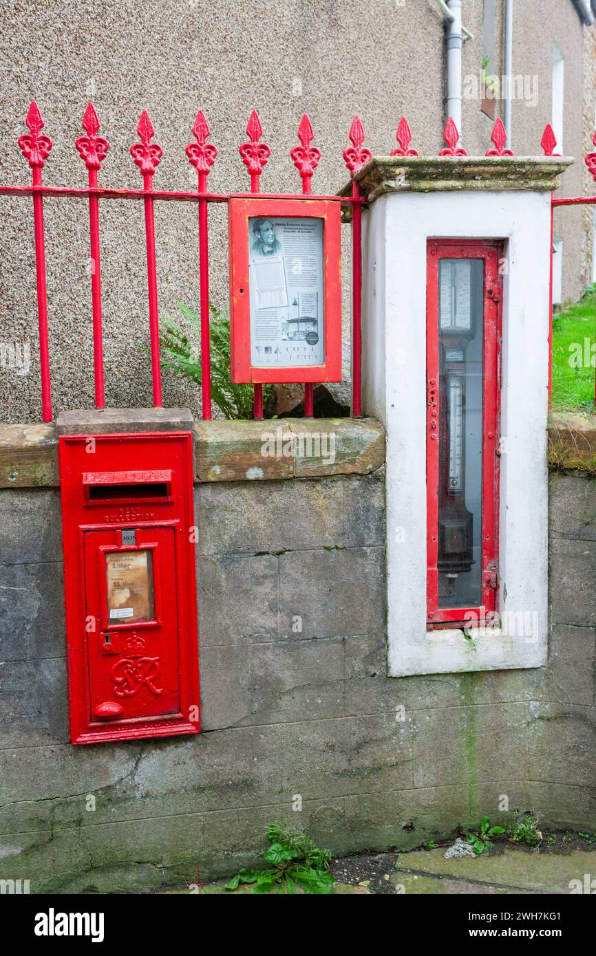 Traditional red post box and barometer, Stromness, Orkney, UK Stock ...
