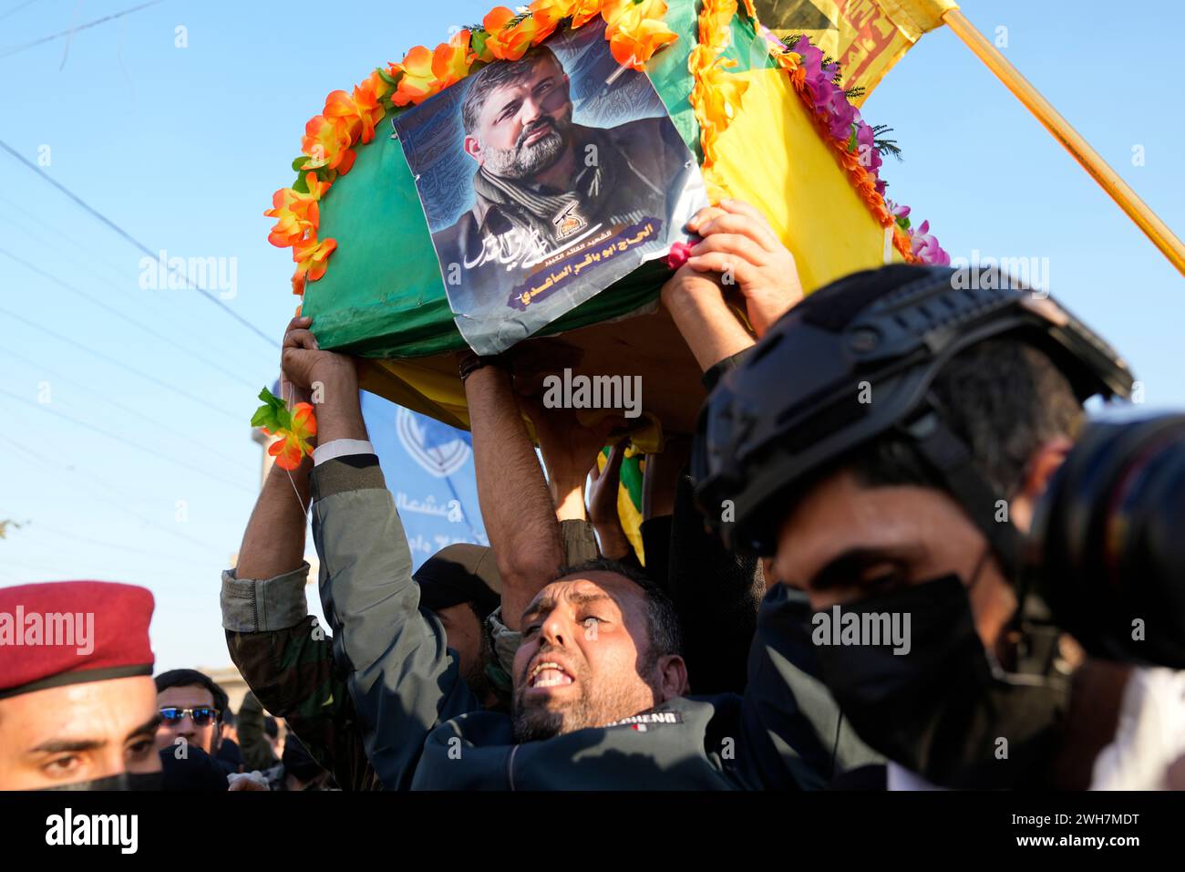 Fighters from the Popular Mobilization Forces, carry the coffin of a ...