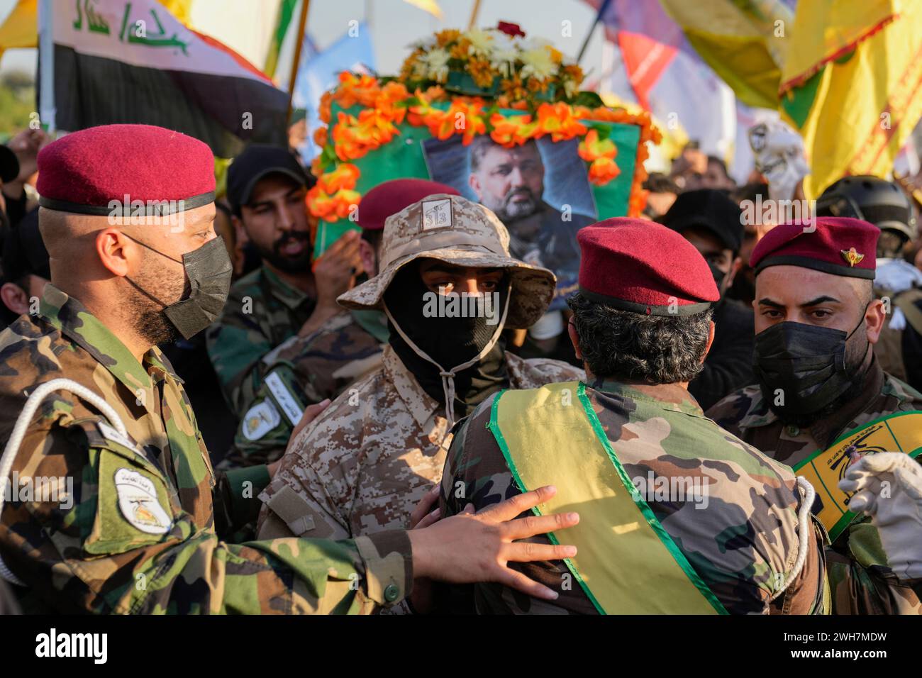 Fighters from the Popular Mobilization Forces, carry the coffin of a ...