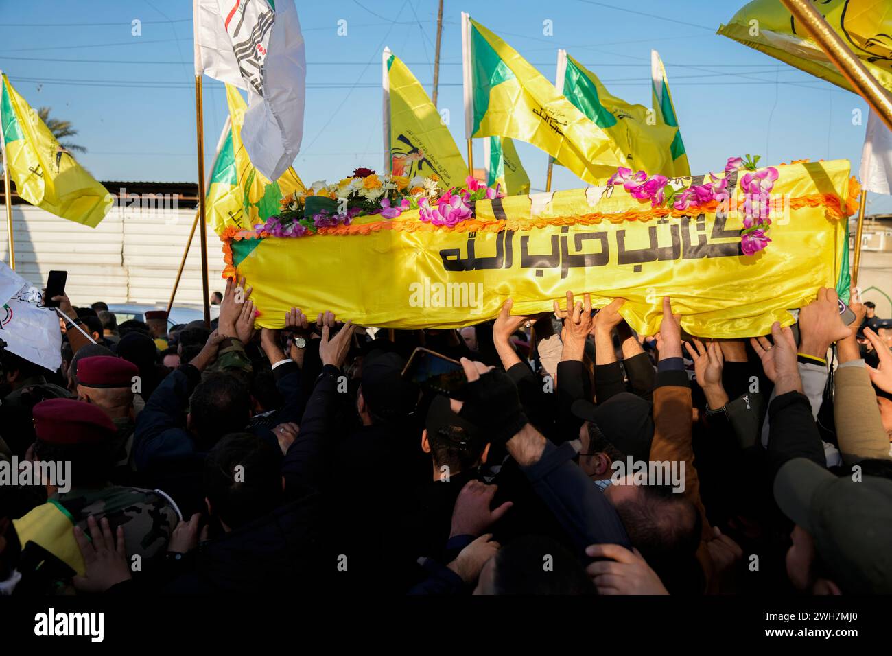 Fighters from the Popular Mobilization Forces, carry the coffin of a ...
