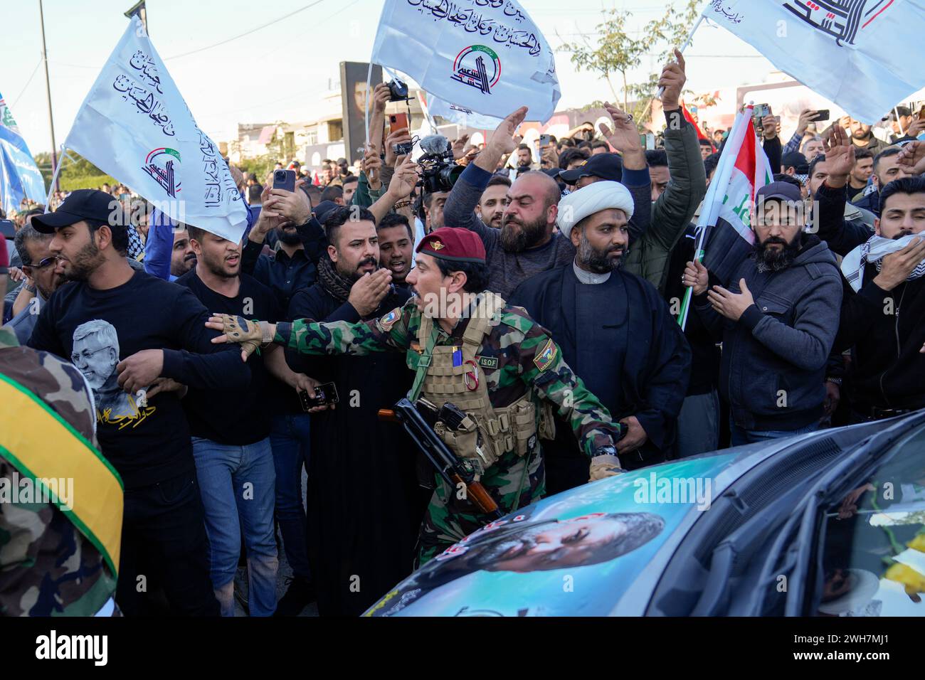 Fighters from the Popular Mobilization Forces, attends the funeral of a ...