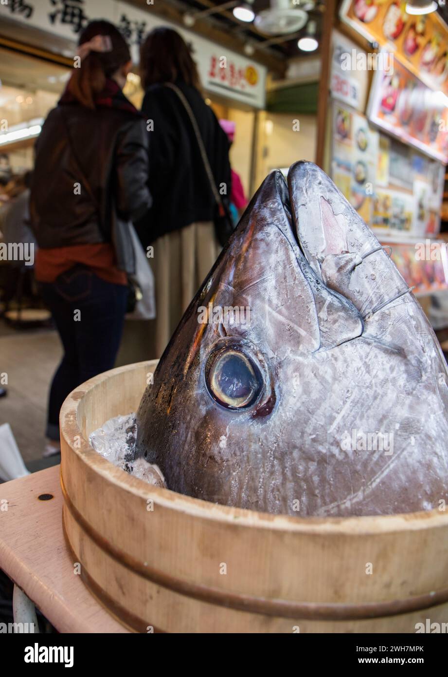 Head of a fish on display in front of a Japanese street market ...