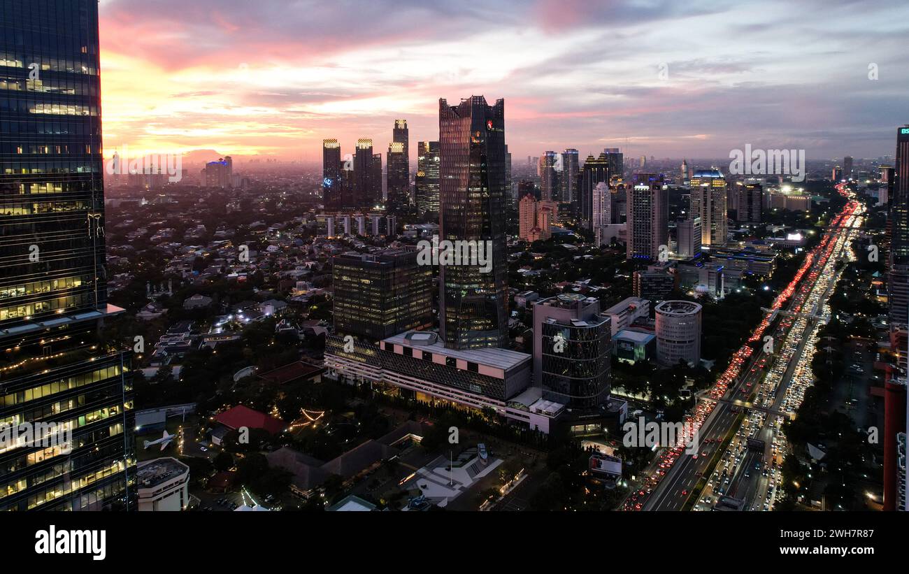 Panoramic cityscape of Indonesia capital city Jakarta at sunset. A rare ...