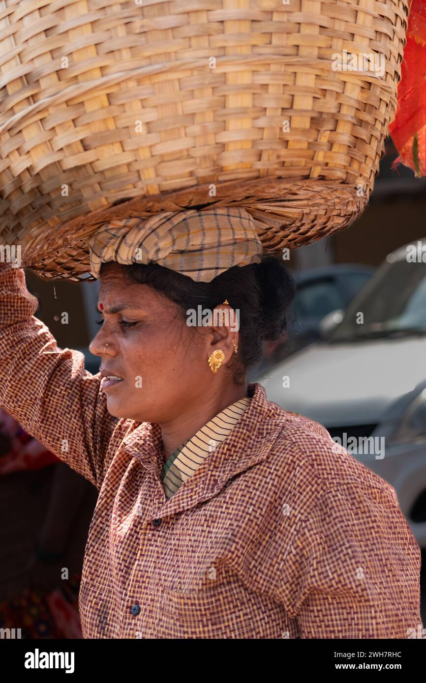 Woman carrying a basket on her head, Goa India. Indian woman with big ...