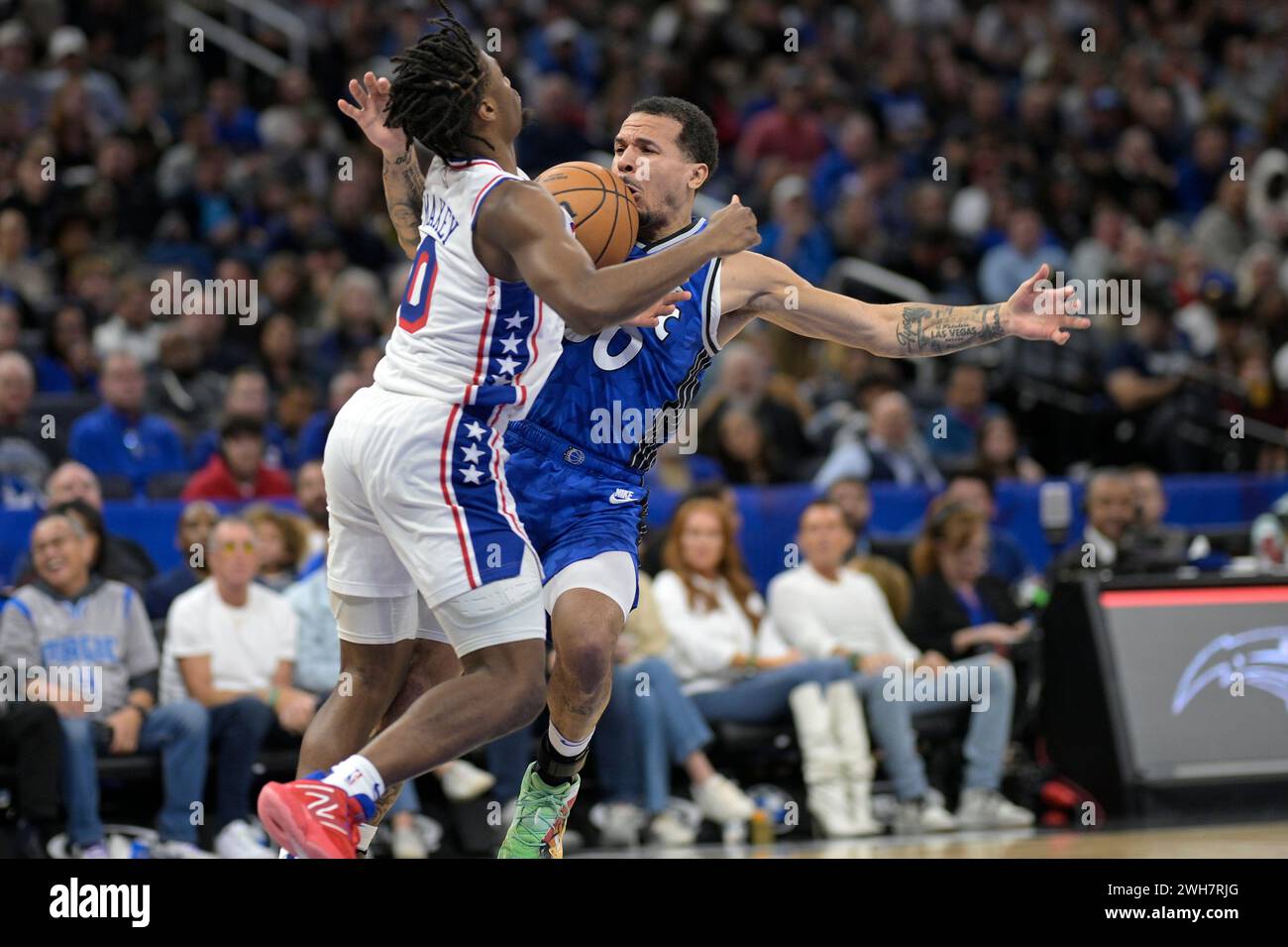 Philadelphia 76ers guard Tyrese Maxey (0) and Orlando Magic guard Cole ...