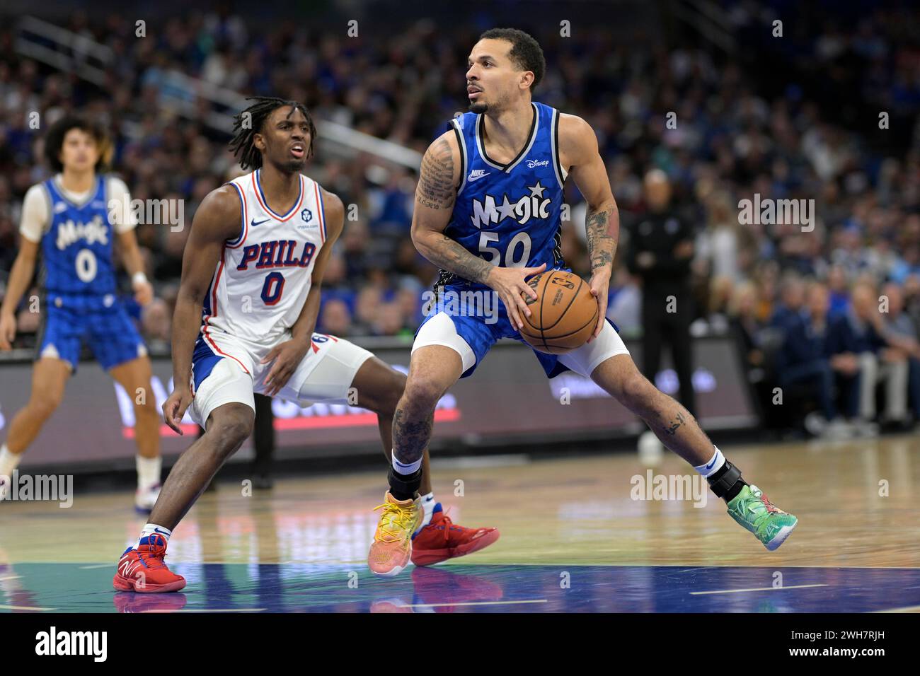 Orlando Magic guard Cole Anthony (50) is defended by Philadelphia 76ers ...