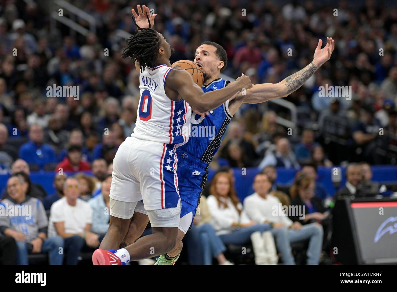 Philadelphia 76ers guard Tyrese Maxey (0) and Orlando Magic guard Cole ...