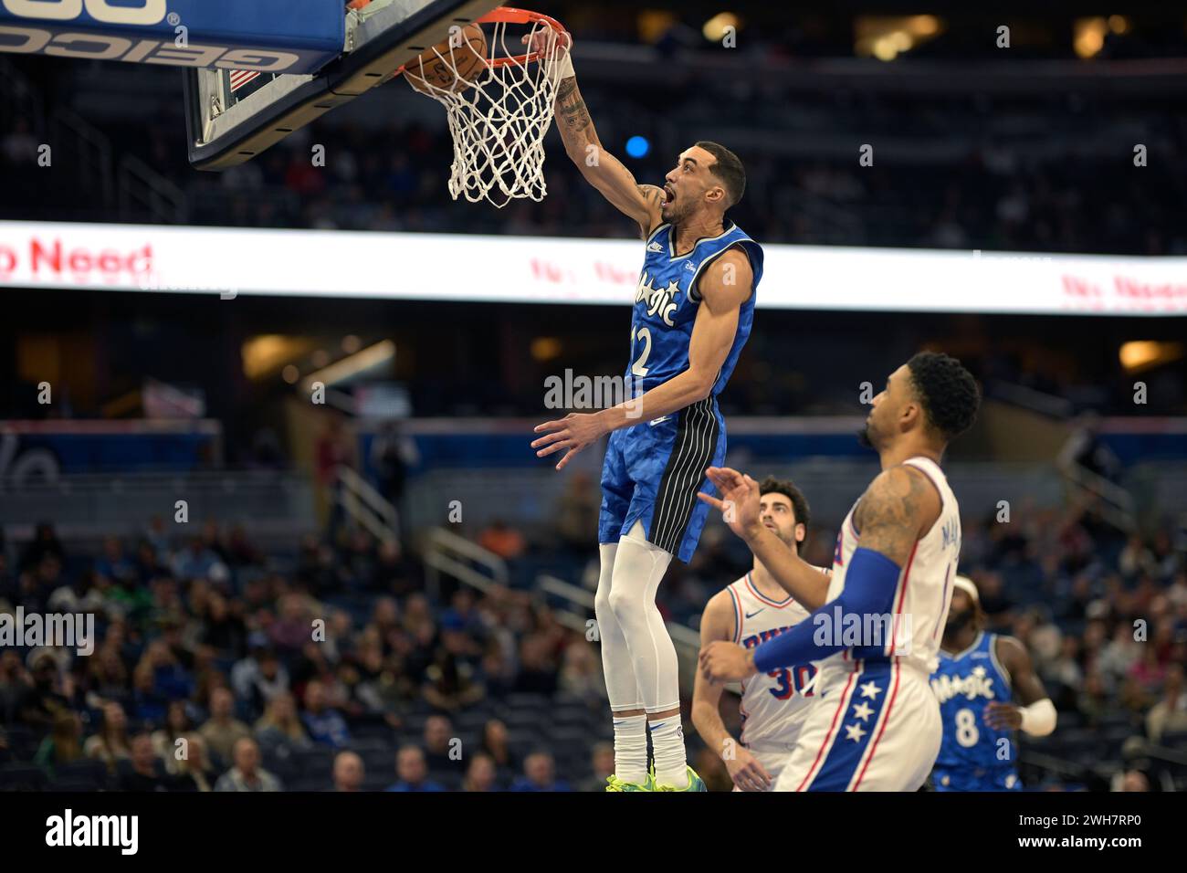 Orlando Magic guard Trevelin Queen (12) dunks as Philadelphia 76ers ...