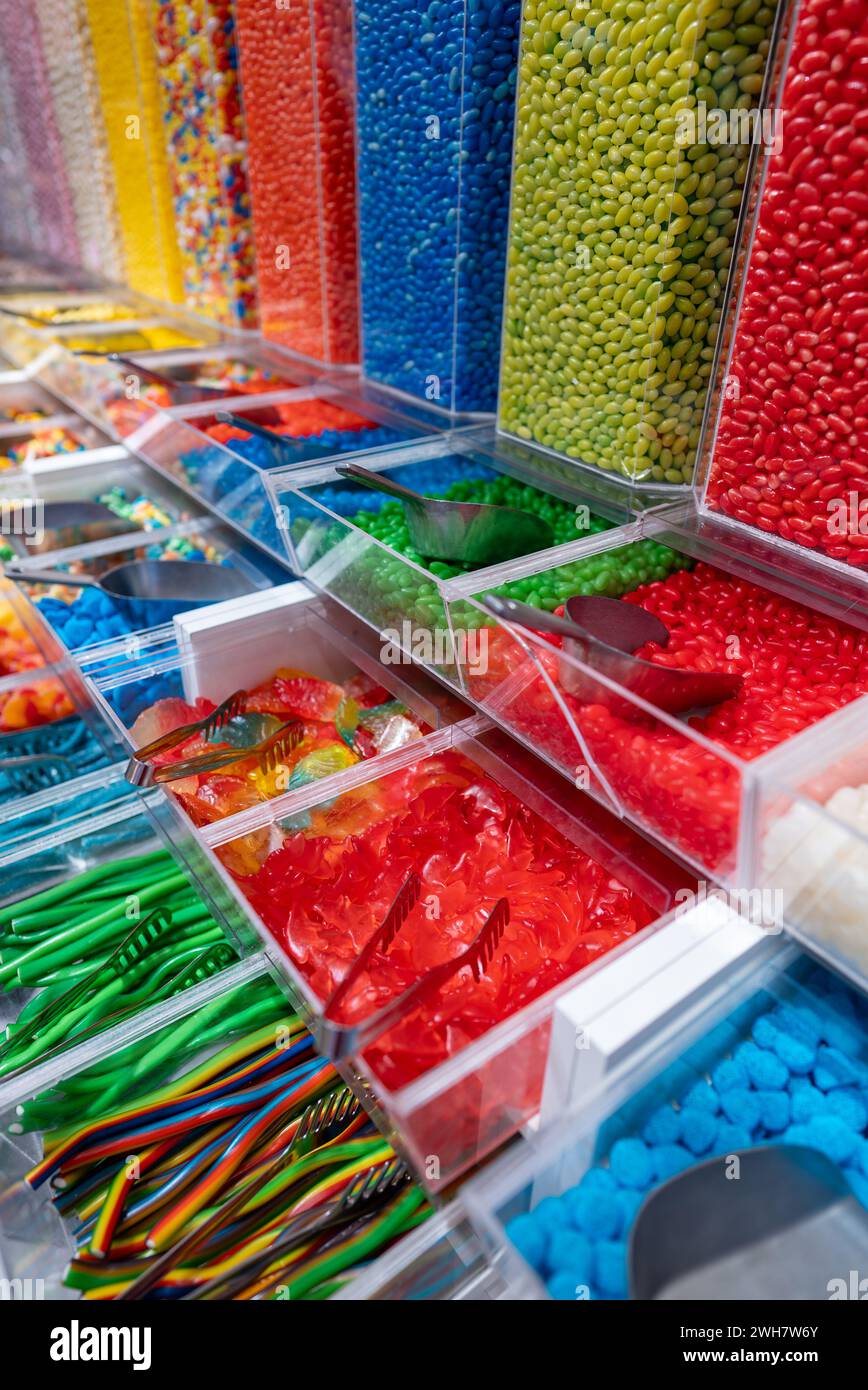 showcase of candy shop, transparent container with various sweets ...