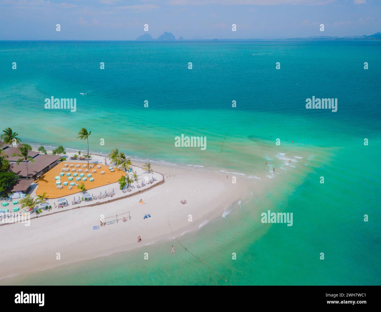 Koh Muk a tropical island with palm trees and soft white sand, and a ...