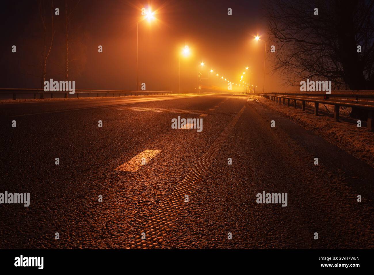 Night empty car road with roadside lights Stock Photo - Alamy
