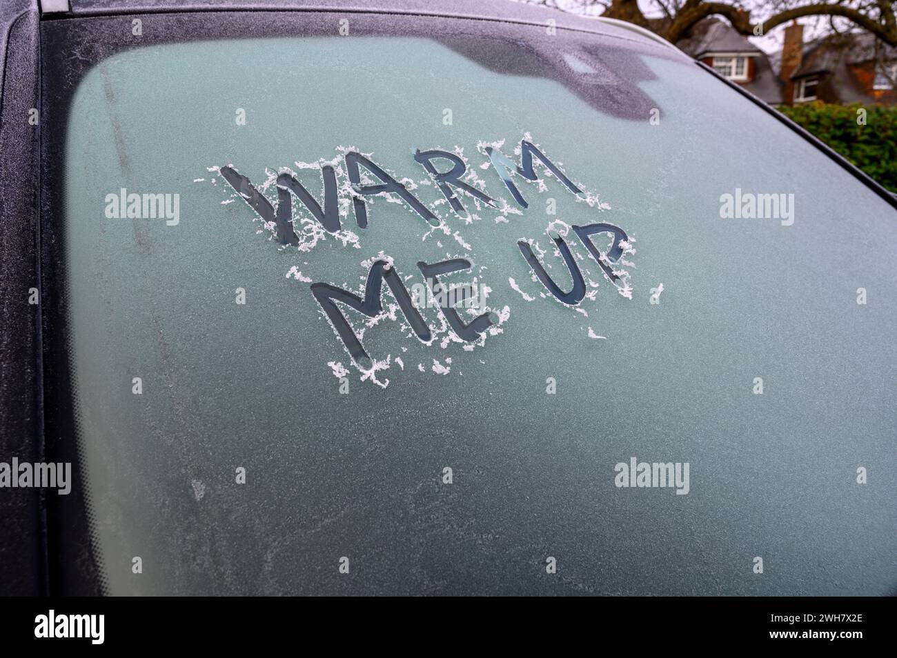 "Warm me up" message written with a finger onto a frosty car windscreen ...