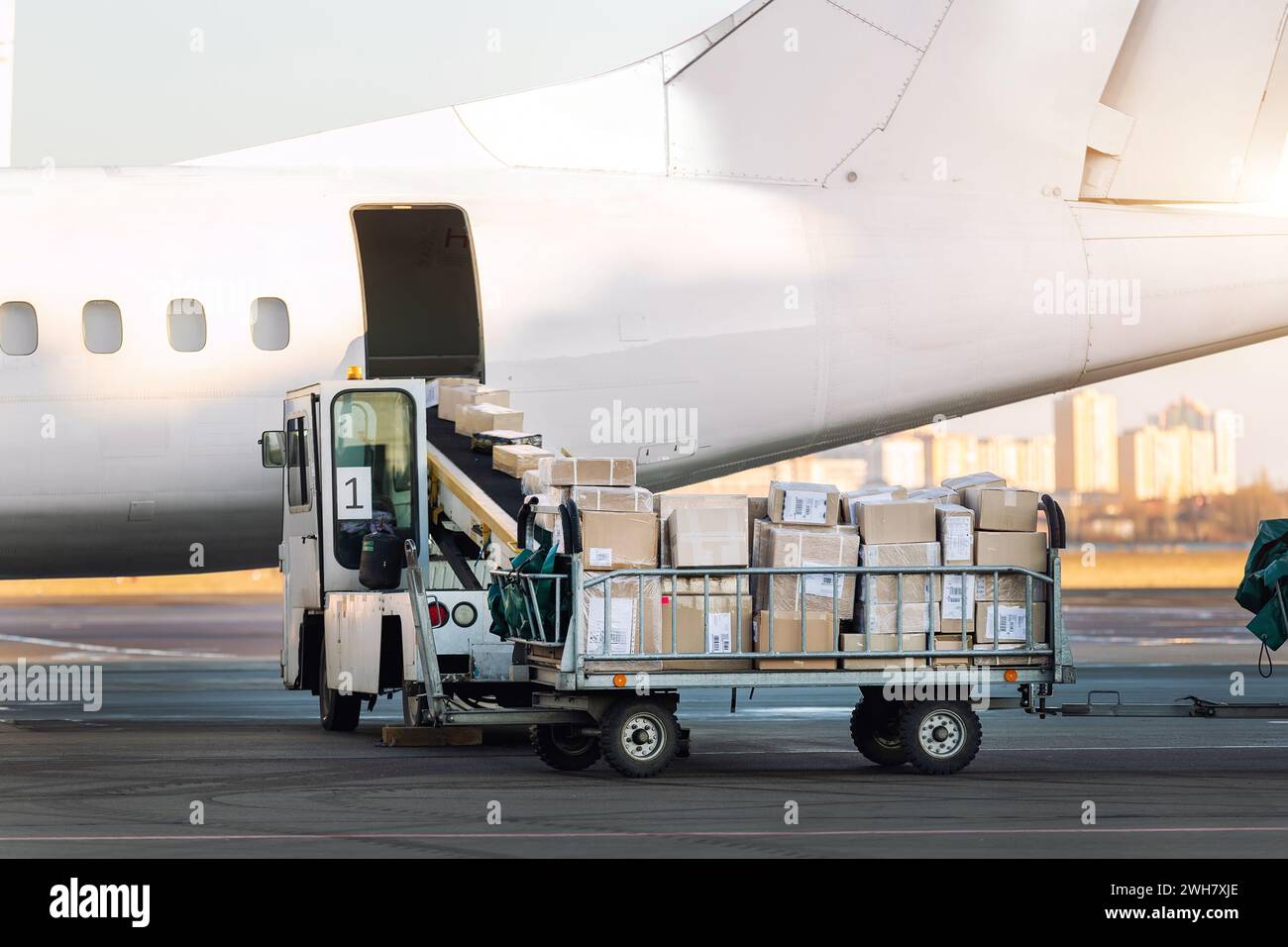 Close-up detail view of cargo cart trolley full with commercial parcels ...