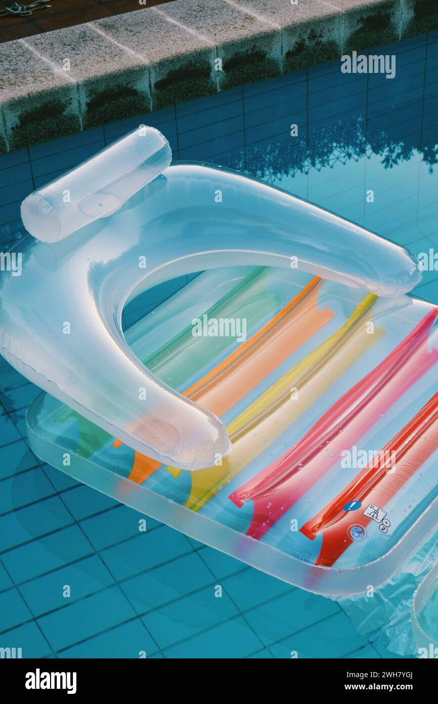 Colorful inflatable mat in a swimming pool, Barcelona, Spain, on August ...