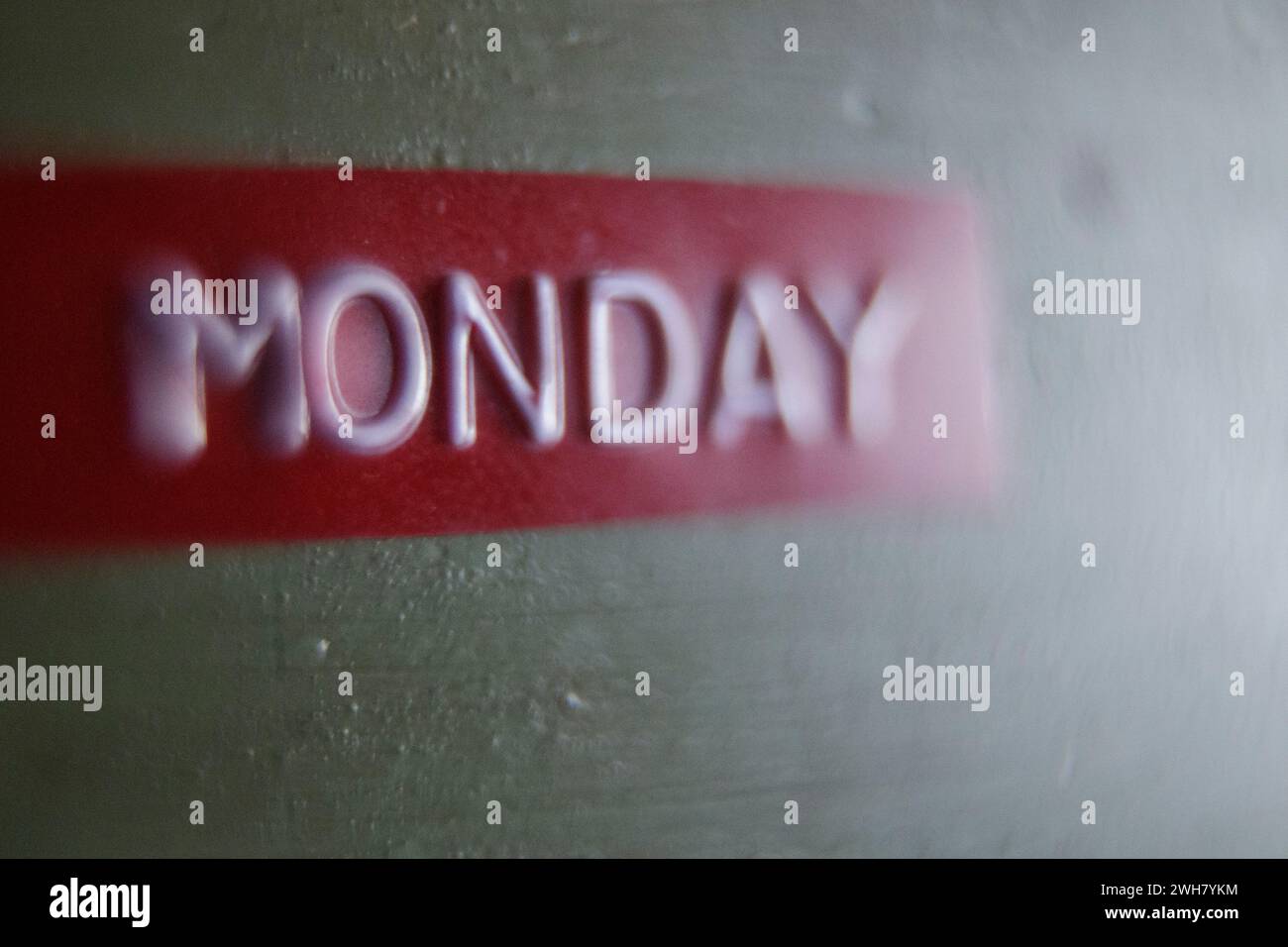 Macro concept photo of printed label of the word Monday on a business ...