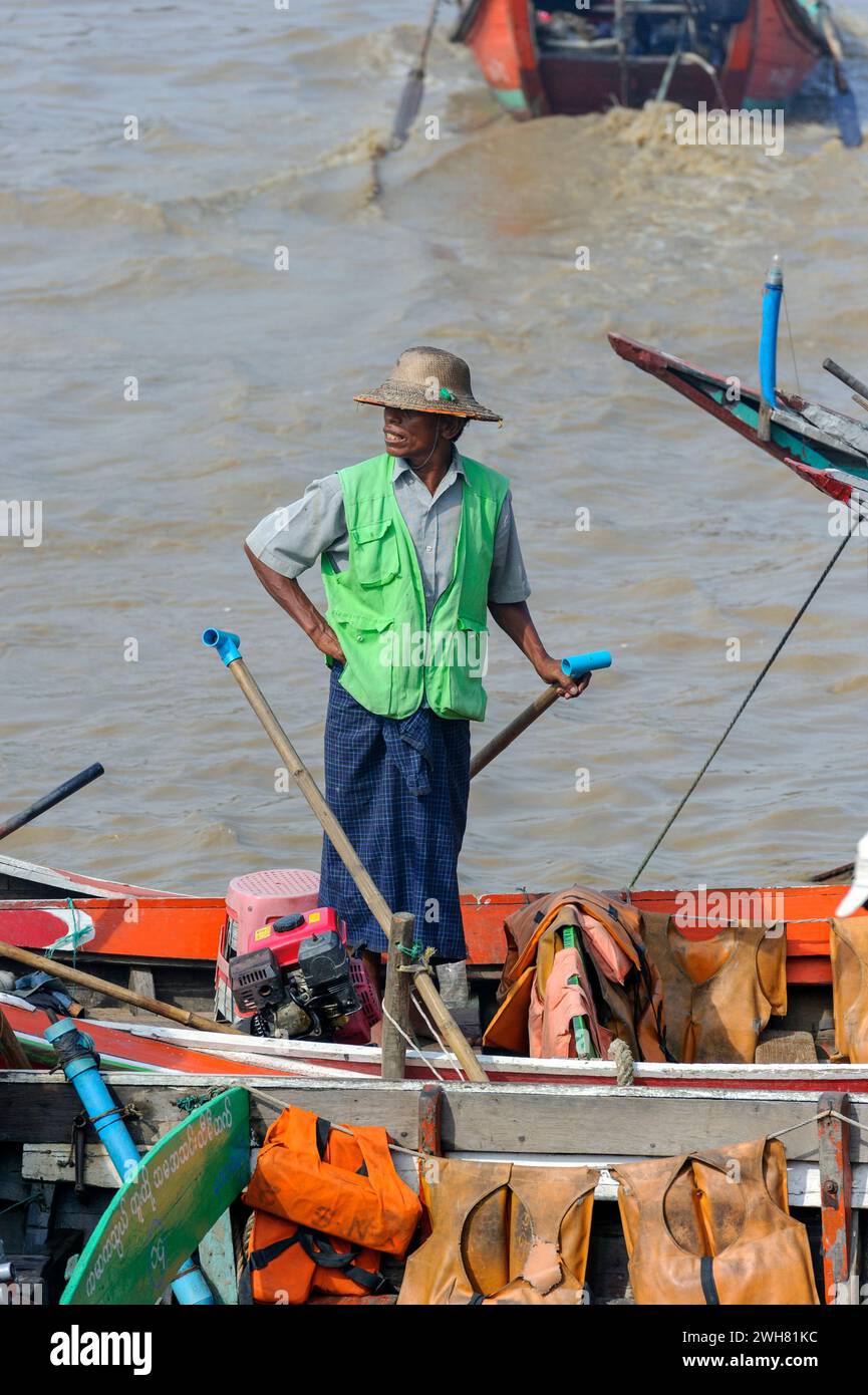 Water taxi or ferry boat driver at the Sin On Dam Jetty, Yangon River ...