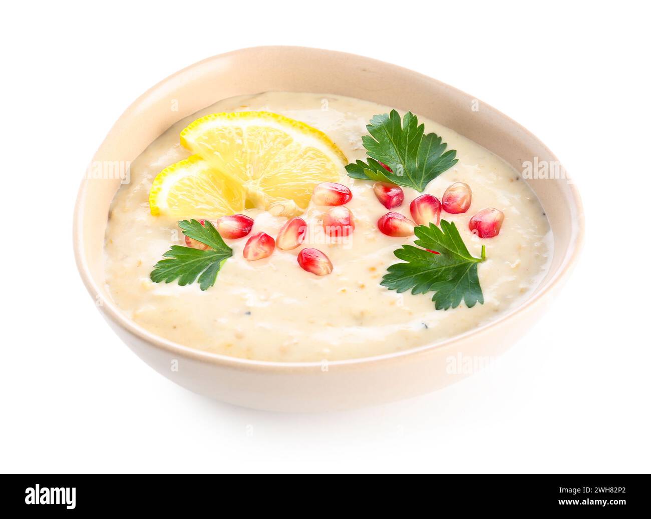 Bowl of tasty baba ghanoush on white background Stock Photo - Alamy
