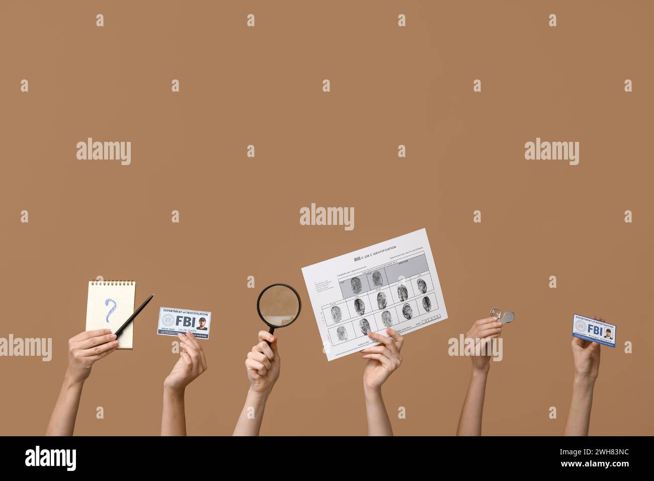 Women with accessories of FBI agent on brown background Stock Photo - Alamy