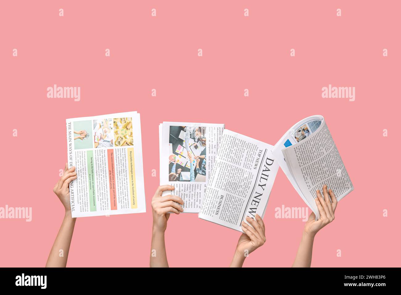 Women with newspapers on pink background Stock Photo - Alamy