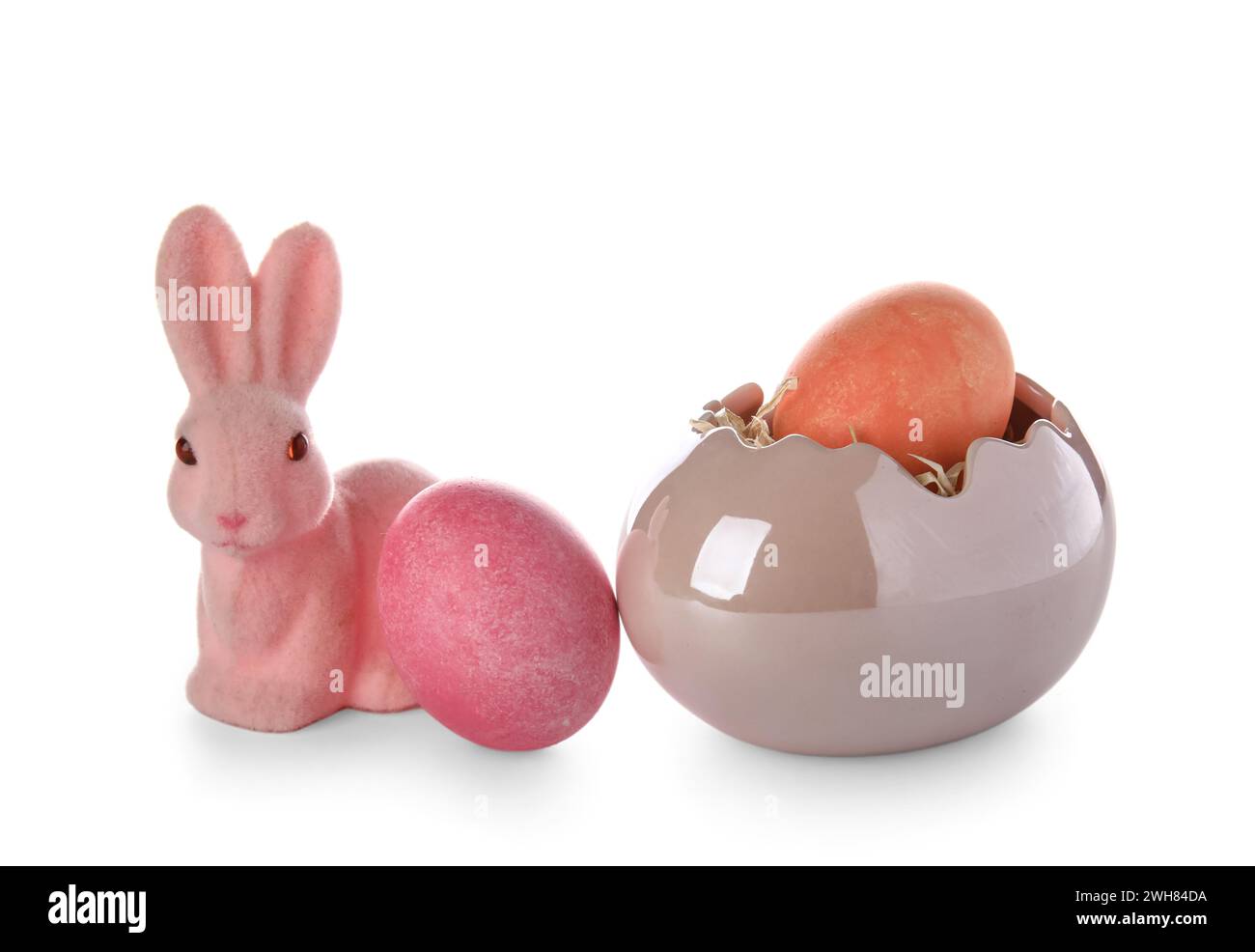 Easter eggs and pink bunny on white background Stock Photo - Alamy