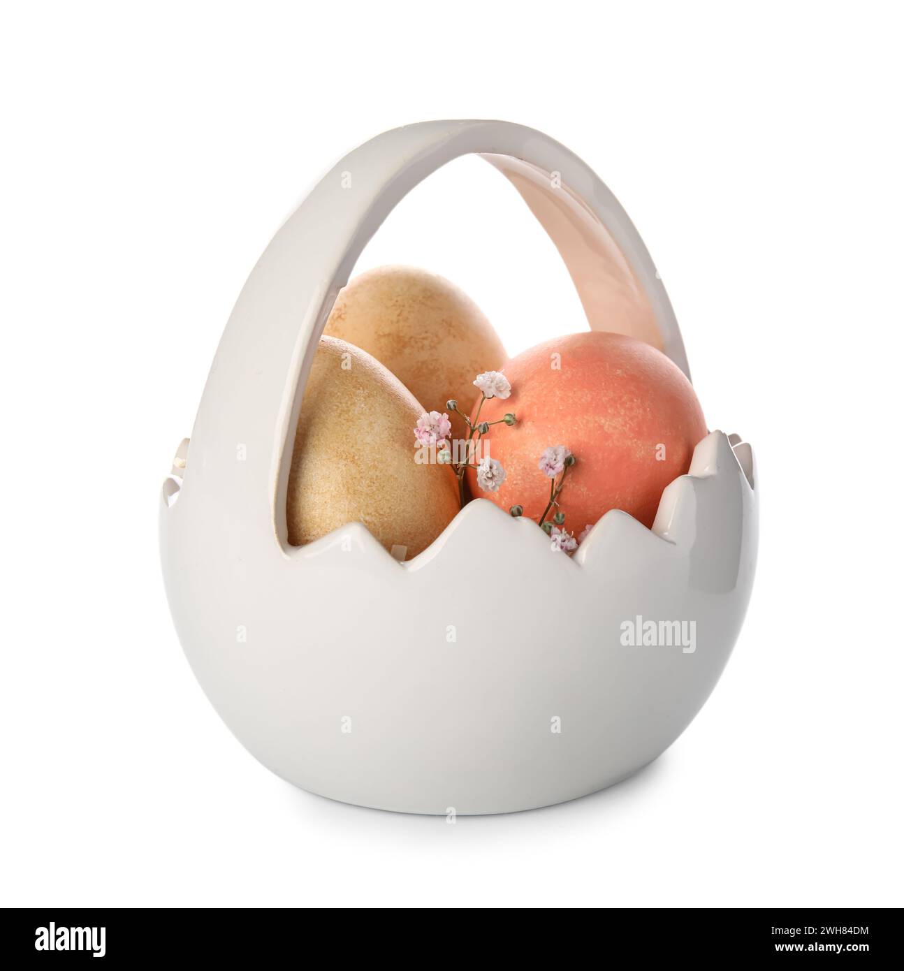 Ceramic basket of Easter eggs on white background Stock Photo - Alamy