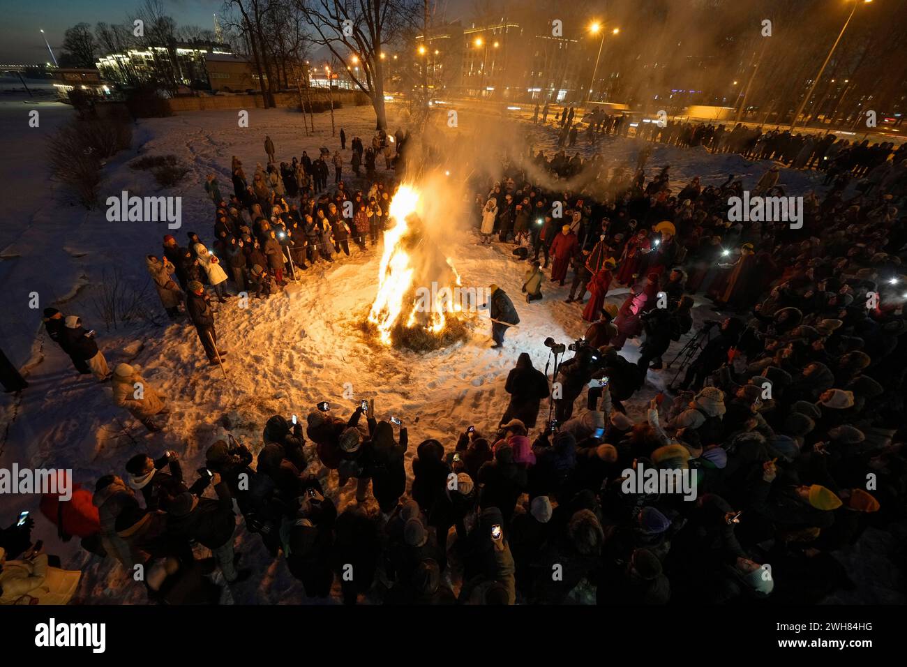 Believers gather around a ritual bonfire during the Dugzhuuba, a ...