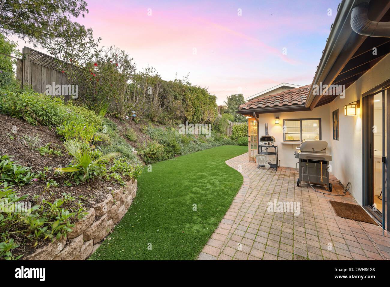 Backyard patio attached to house Stock Photo - Alamy