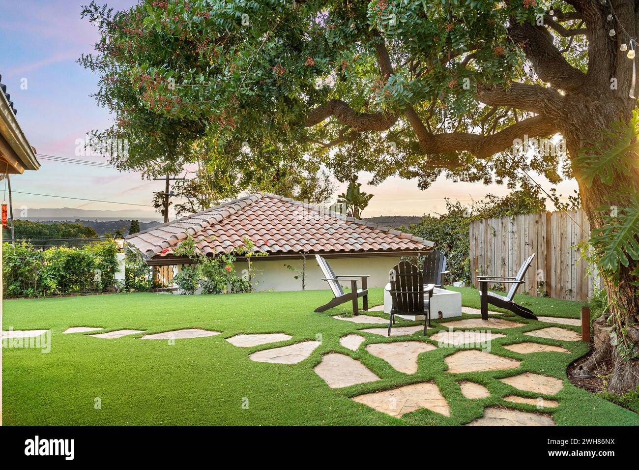 Beautiful outdoor space with shaded seating, including chairs, a table ...