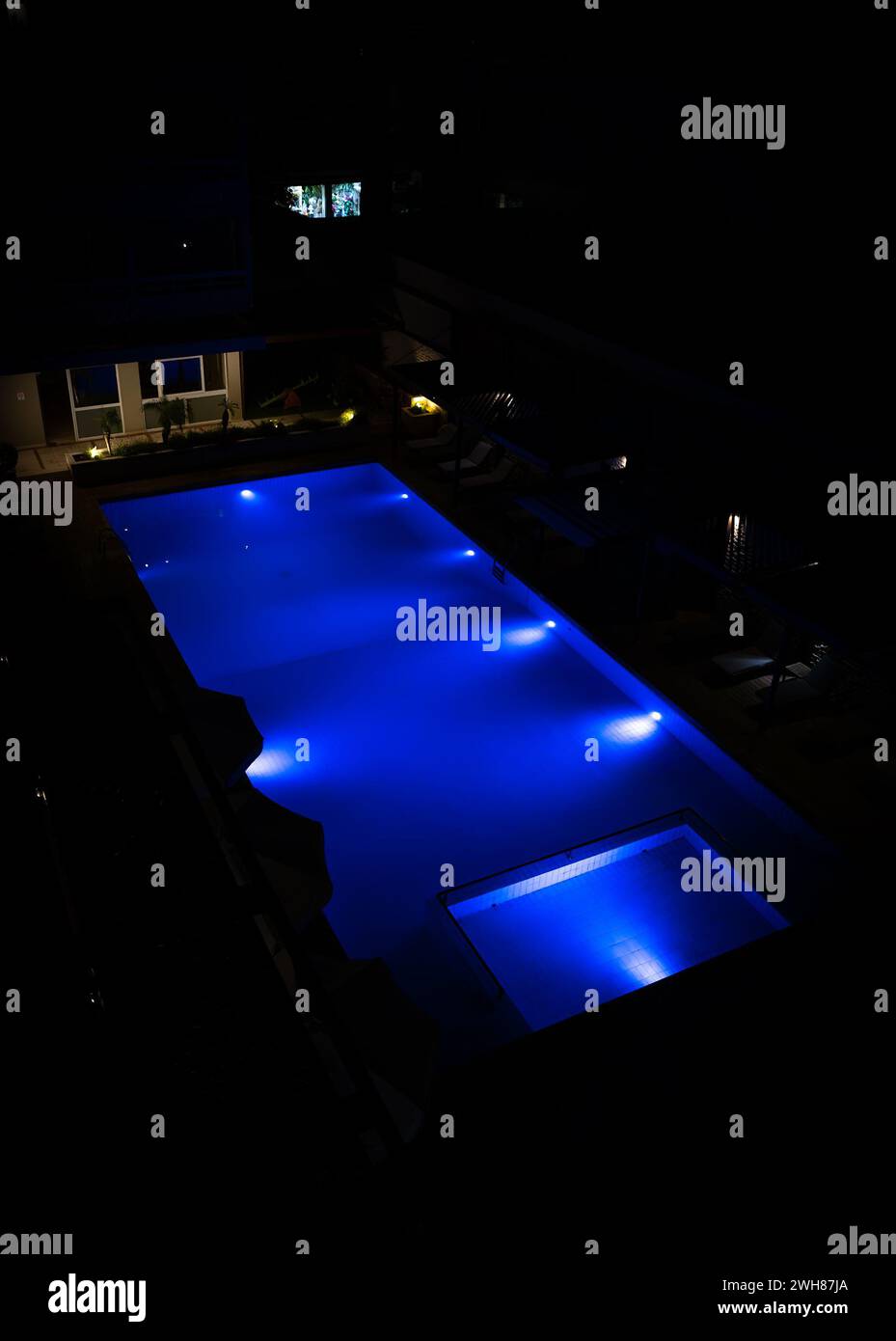 Modern backyard water pool at night Stock Photo - Alamy