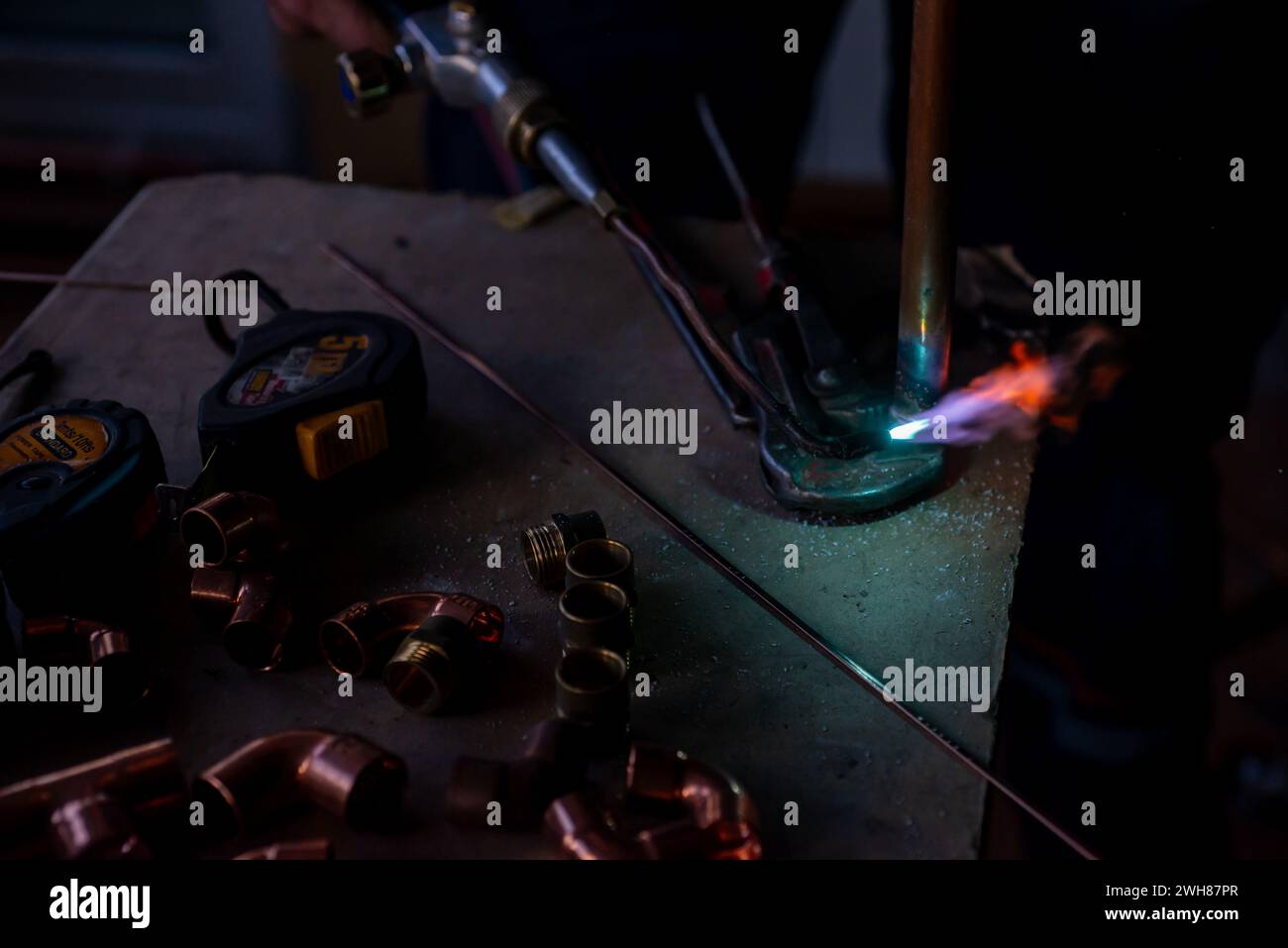Worker welds copper tube hi-res stock photography and images - Alamy