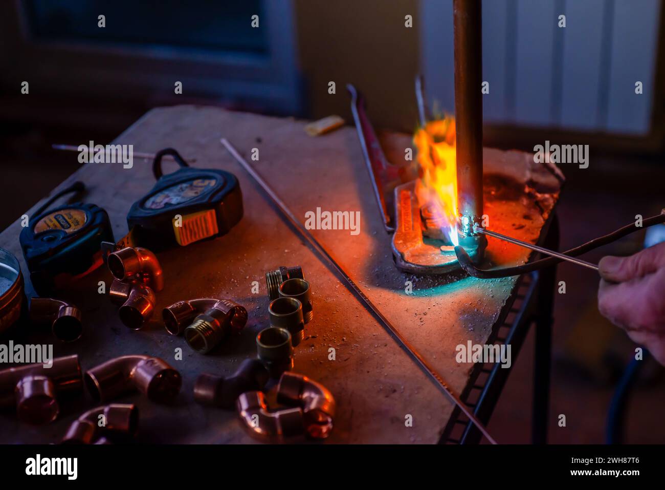 Worker welds copper tube hi-res stock photography and images - Alamy