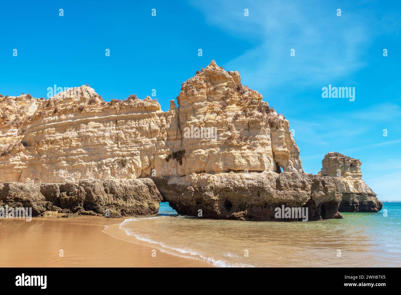 Scenic rocks on the Praia Dona Ana sandy beach in Lagos. Algarve ...