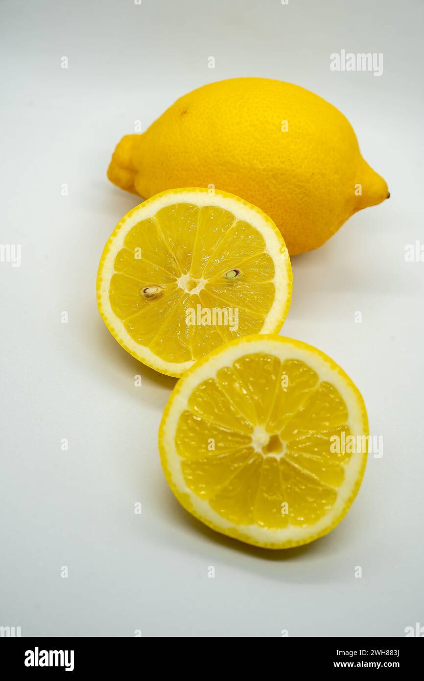Freshly sliced lemons, perfectly halved and ready for consumption Stock ...