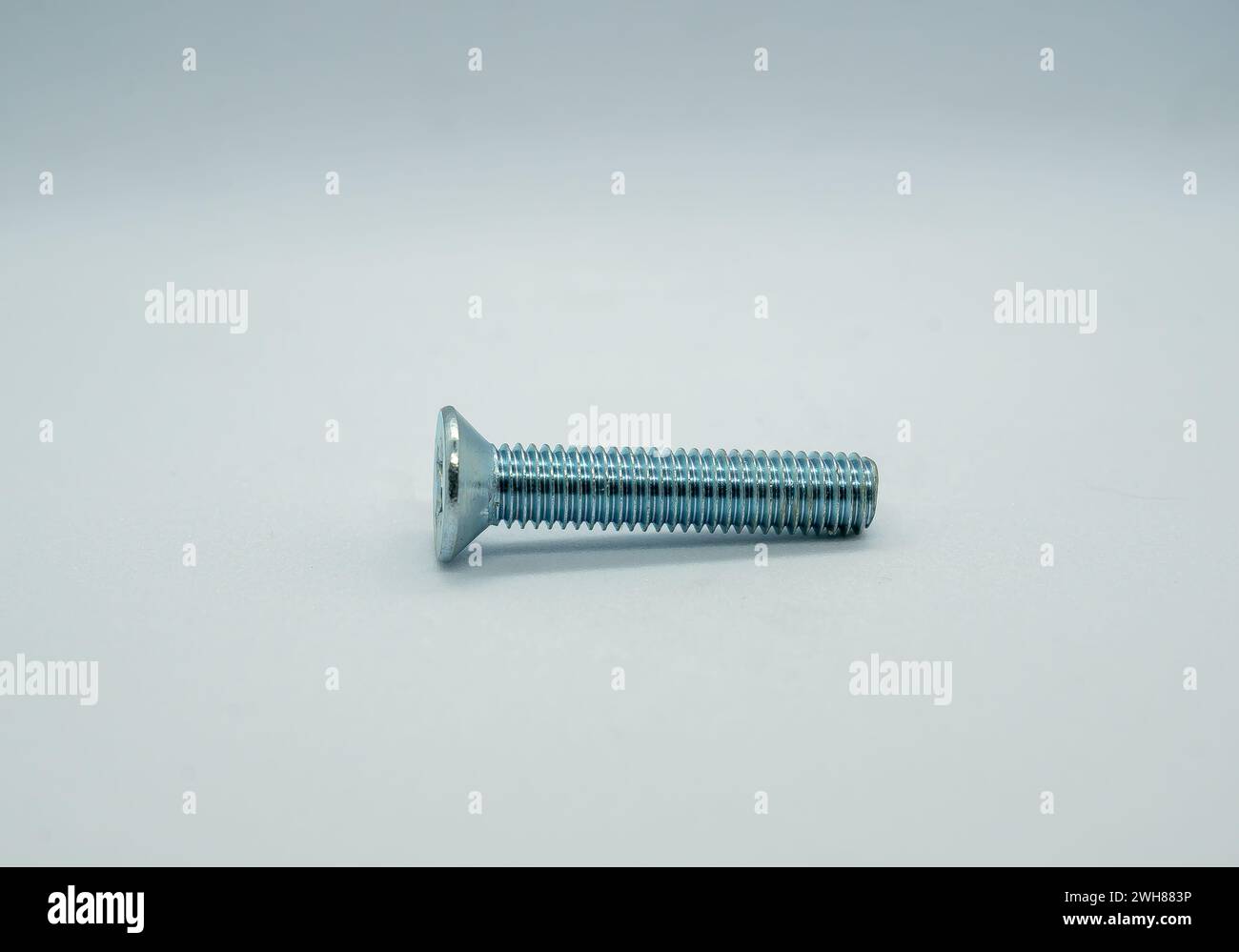 Screw on floor in center of room Stock Photo - Alamy