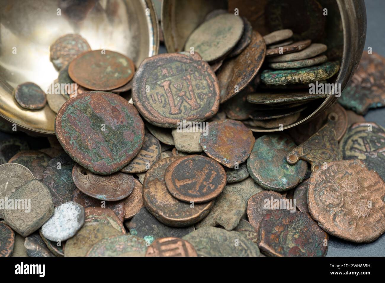 A collection of antique coins, relics, historical artifacts of the past ...