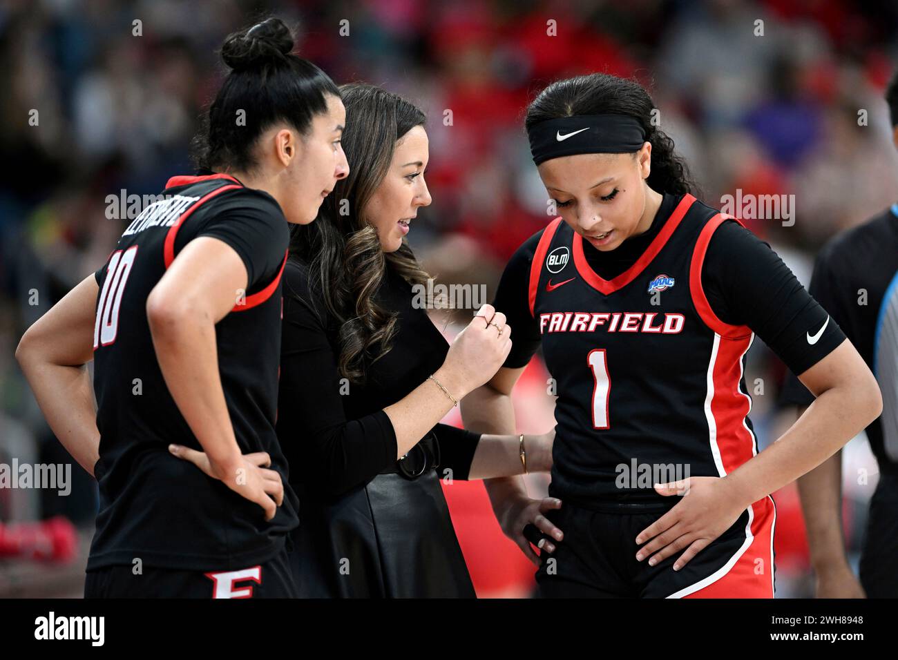 Fairfield coach Carly Thibault speaks with Kendall McGruder (1) and ...