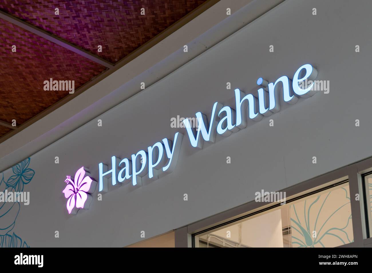 Close-up of Happy Wahine logo sign at their store in a shopping mall in ...
