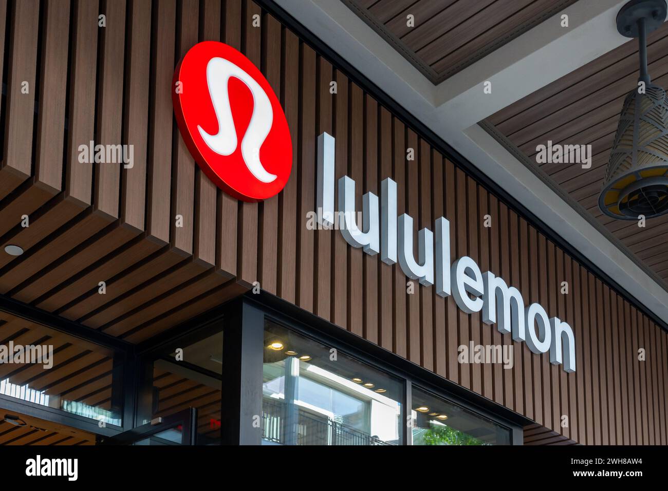 Close-up of Lululemon logo sign at their store in a shopping mall in ...