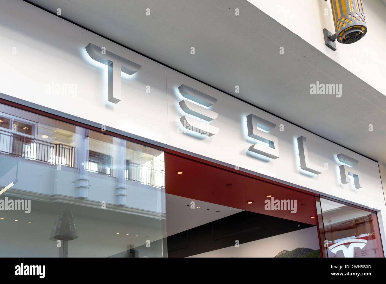 Close-up of Tesla logo sign at their showroom in a shopping mall in ...