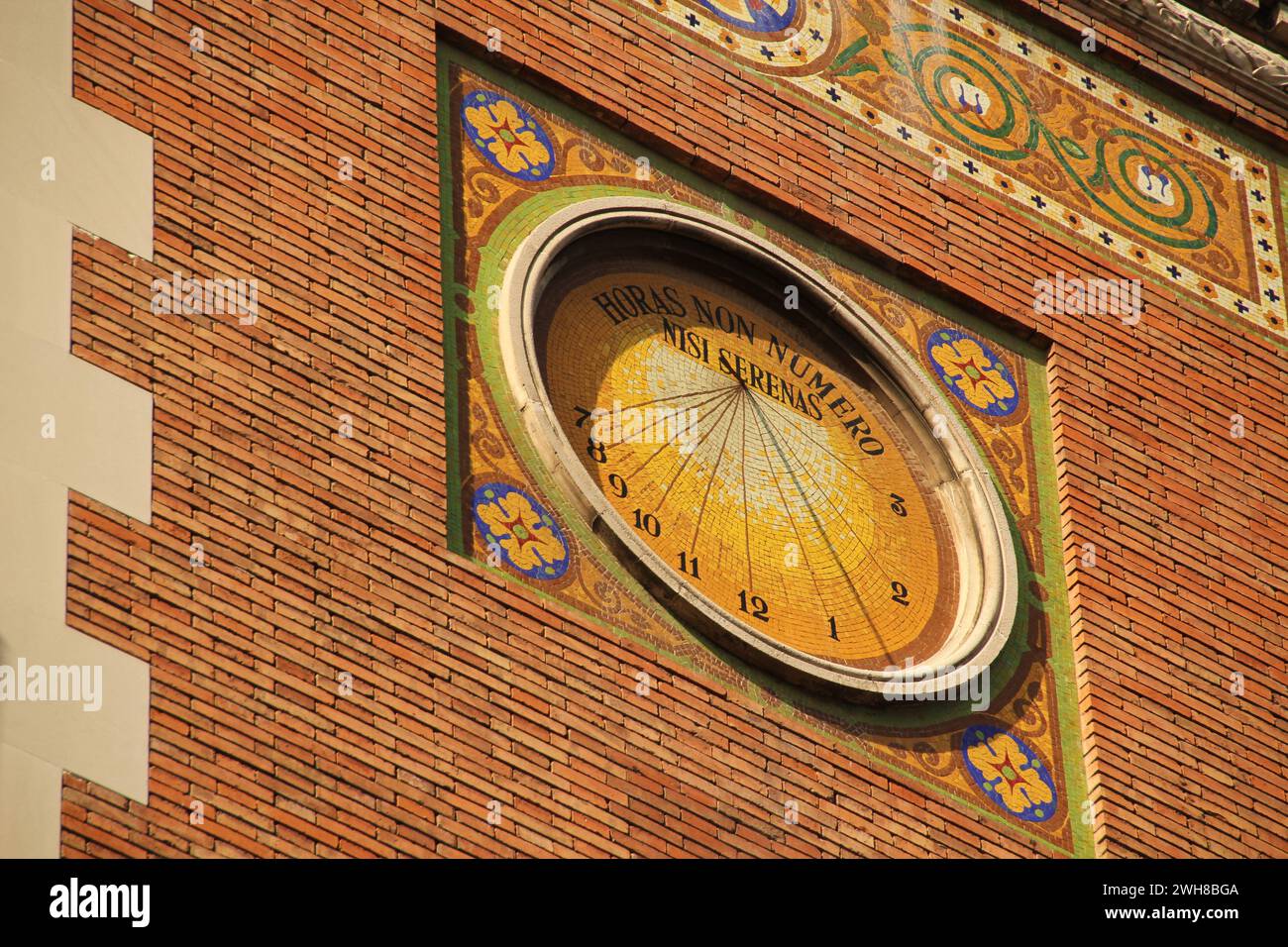 Vibrant sun dial clock in orange and yellow Stock Photo - Alamy