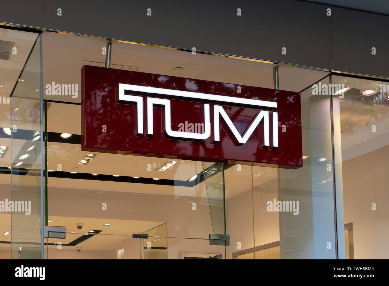 TUMI hanging sign at the store in a shopping mall in Waikiki, Hawaii ...
