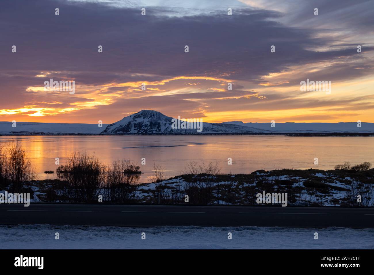 Colorful cloudy sky during the sunset. Lake with a clam water and on a ...