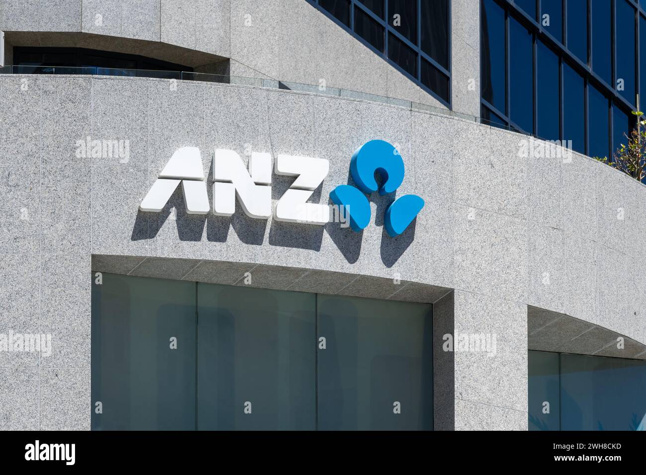 Close-up of ANZ Bank logo sign on the building in Auckland, New Zealand ...