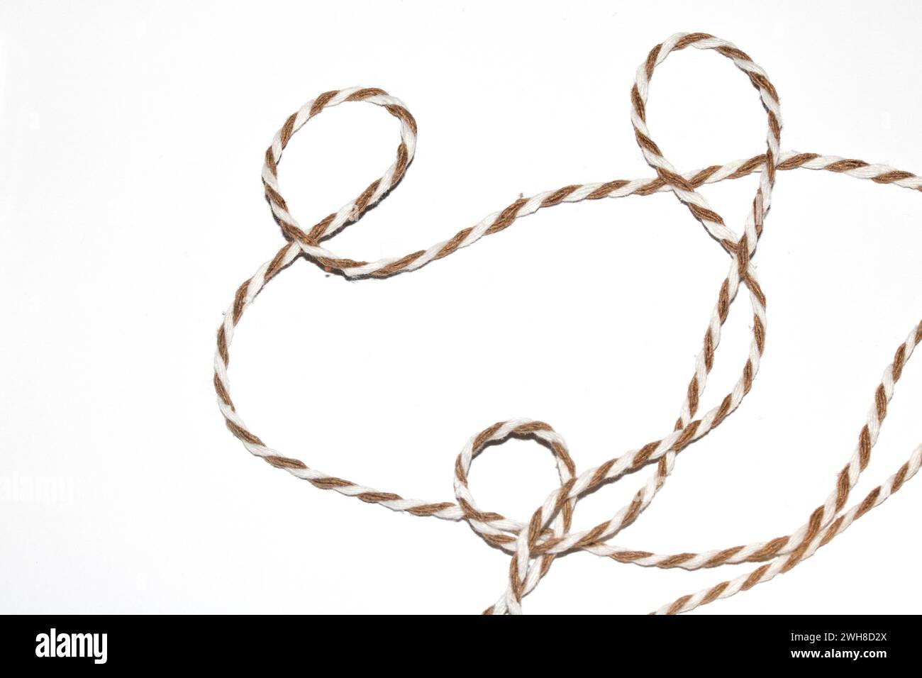 A Wrapping Paper Stripy String Rope Close Up on White Background Stock ...